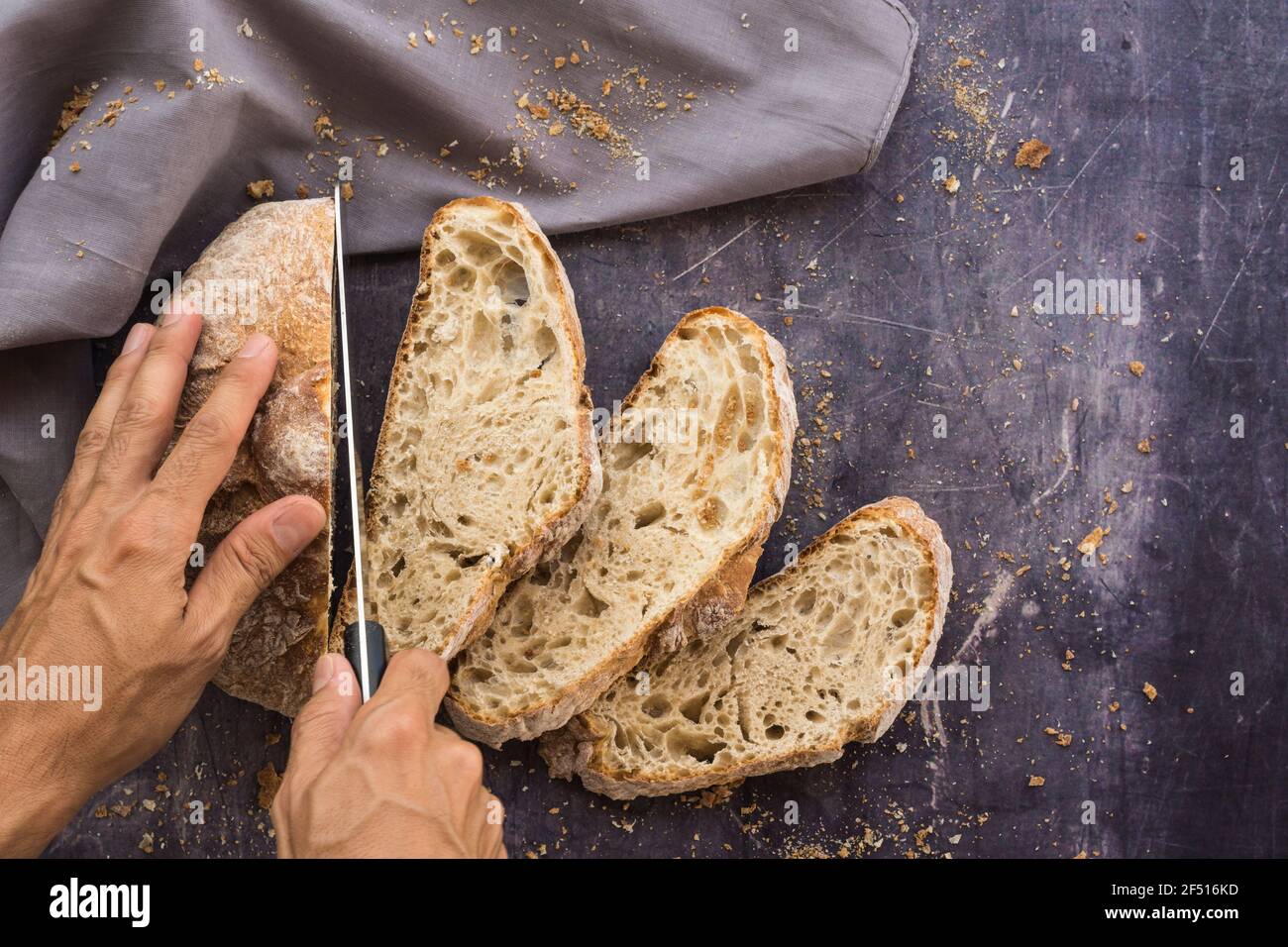 Breaking bread hands hi-res stock photography and images - Alamy