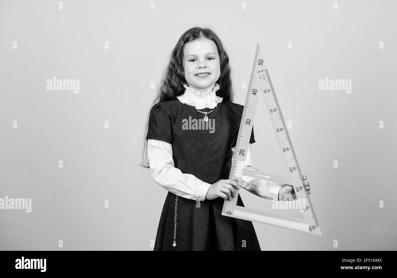 Kid school uniform hold ruler. I love mathematics. Education and school ...