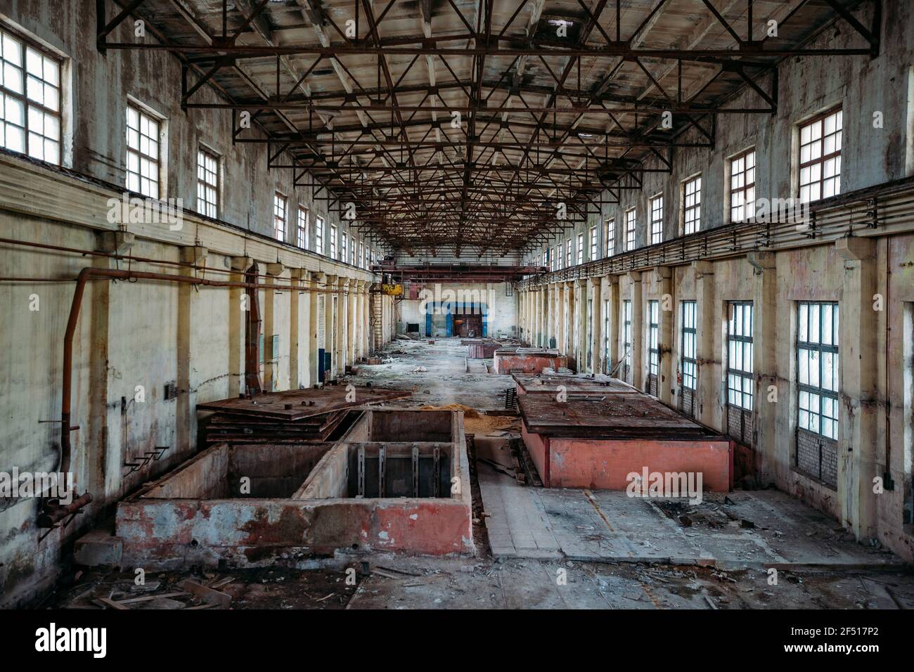 Abandoned concrete factory. Large empty industrial hall Stock Photo - Alamy