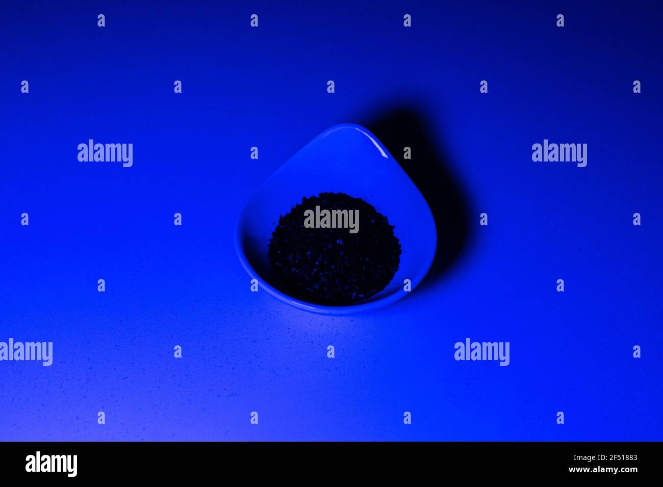 container filled with cayenne pepper to enhance the flavor of food on ...