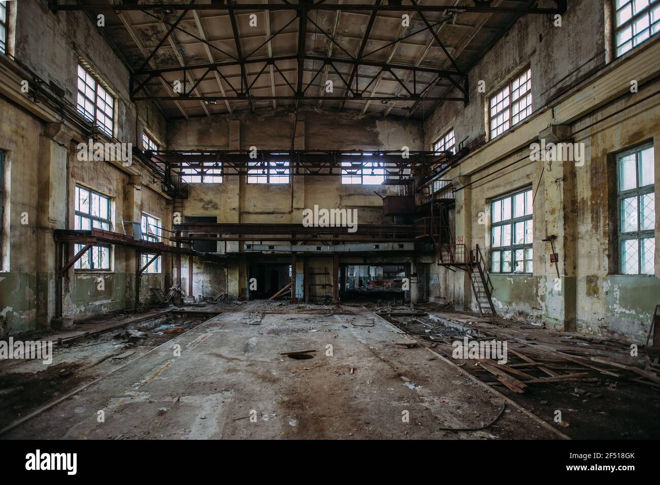 Abandoned concrete factory. Large empty industrial hall Stock Photo - Alamy