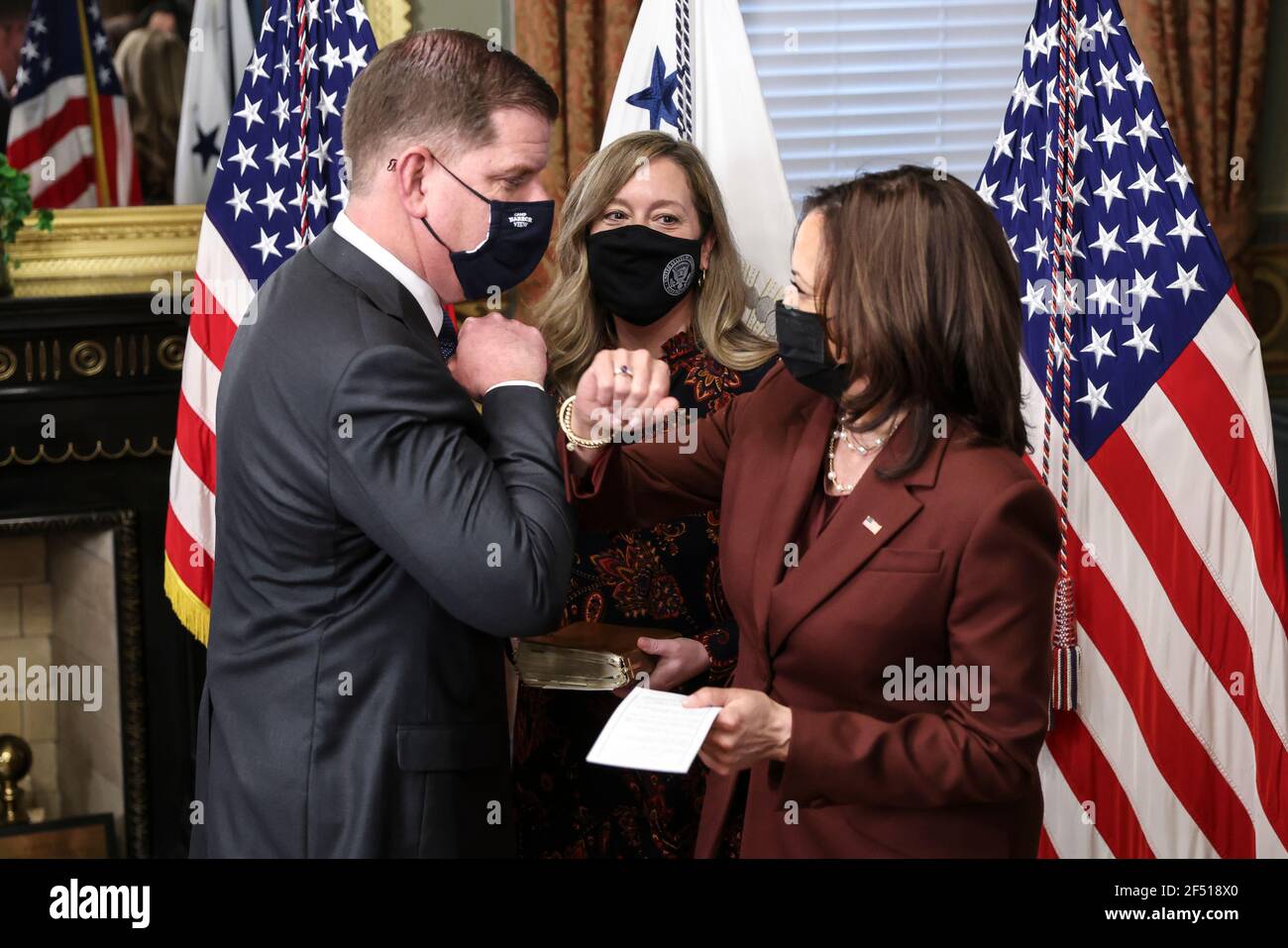 Vice President Kamala Harris, right greets the new Labor Secretary ...