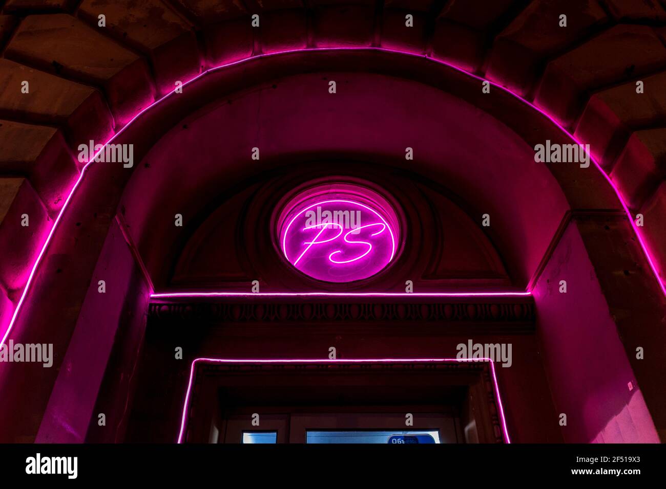 neon postscript Inscription text pink color building Stock Photo - Alamy