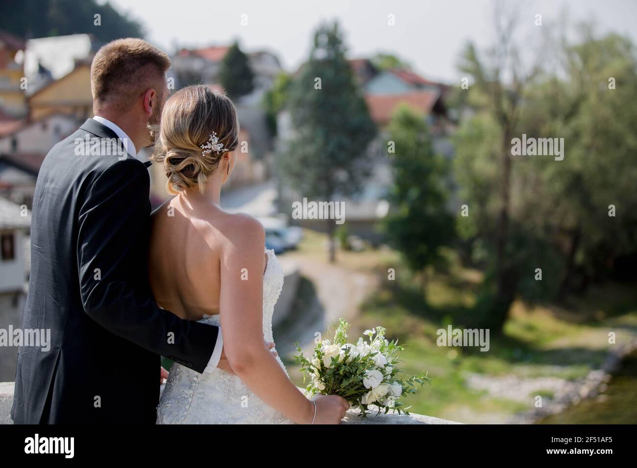 Back view of couples during a wedding ceremony admiring the beauty of ...