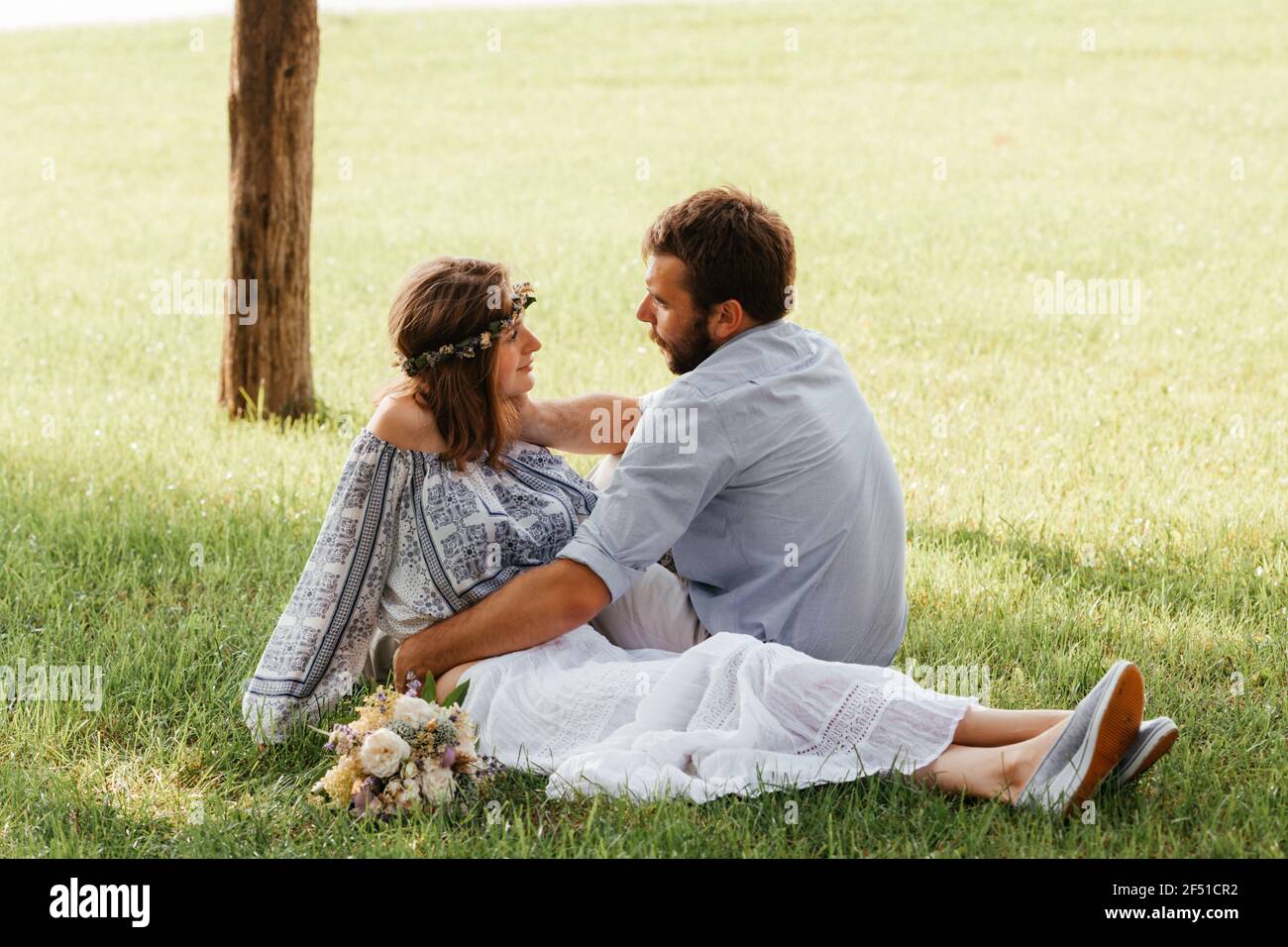Eclectic rustic wedding couple. Intimate ceremony at backyard Stock ...