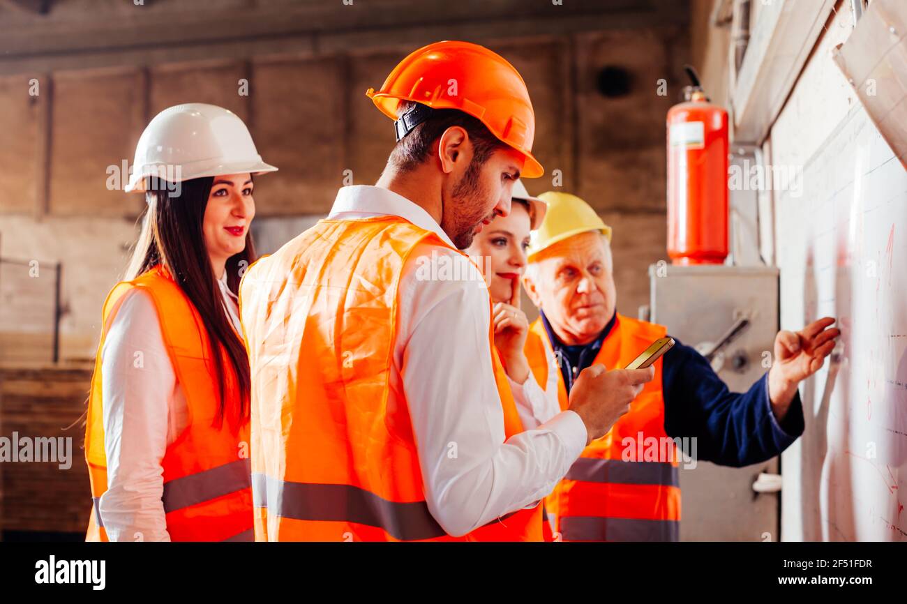 The engineers enjoy the work at the enterprise Stock Photo - Alamy