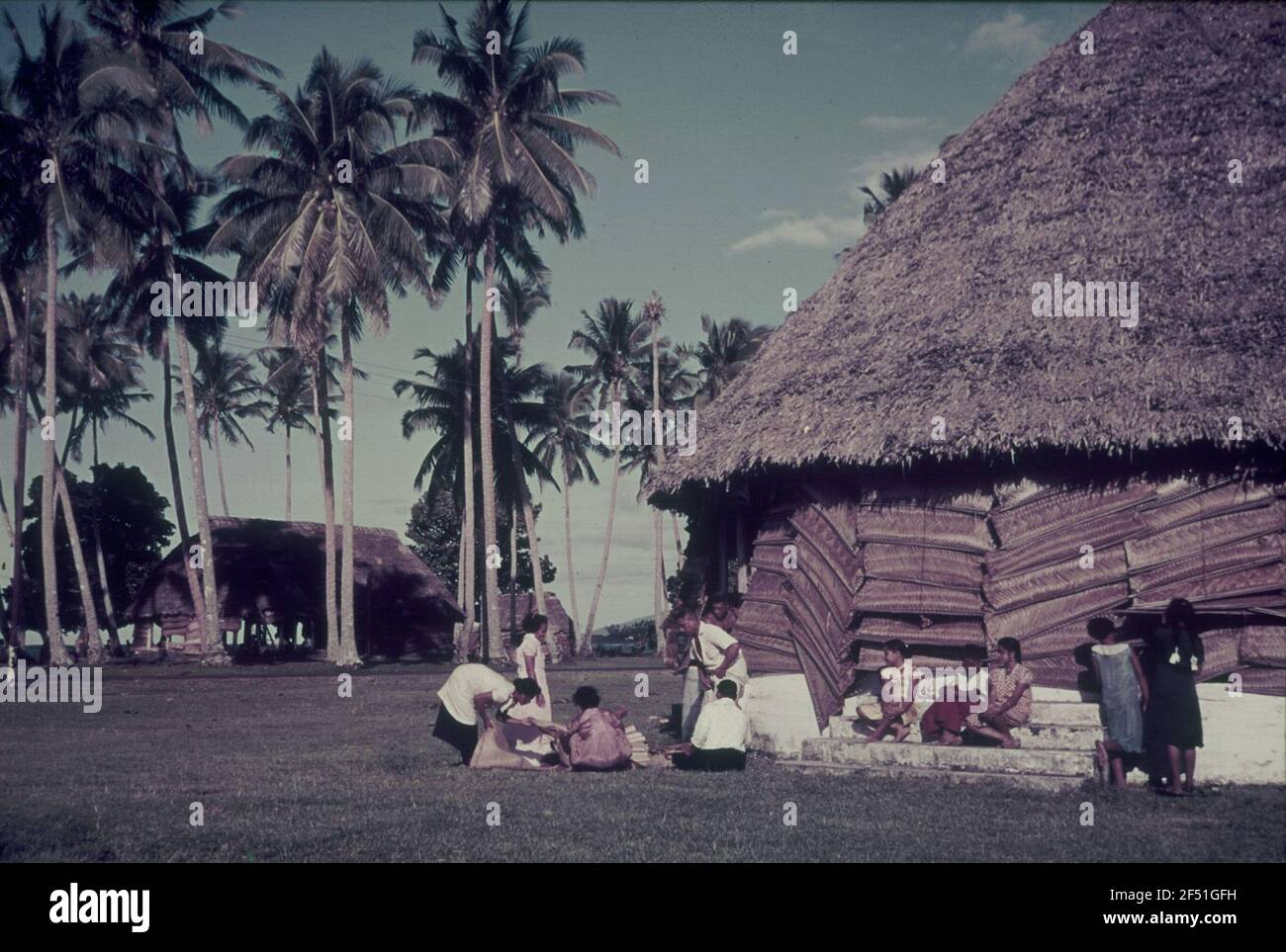 Travel Photos Polynesia. Locals in front of a hut (fale) on the Samoa ...