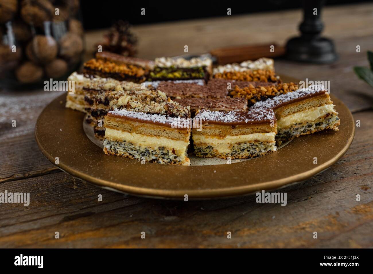 Plate of a variety of freshly baked cakes on a wooden table in the ...