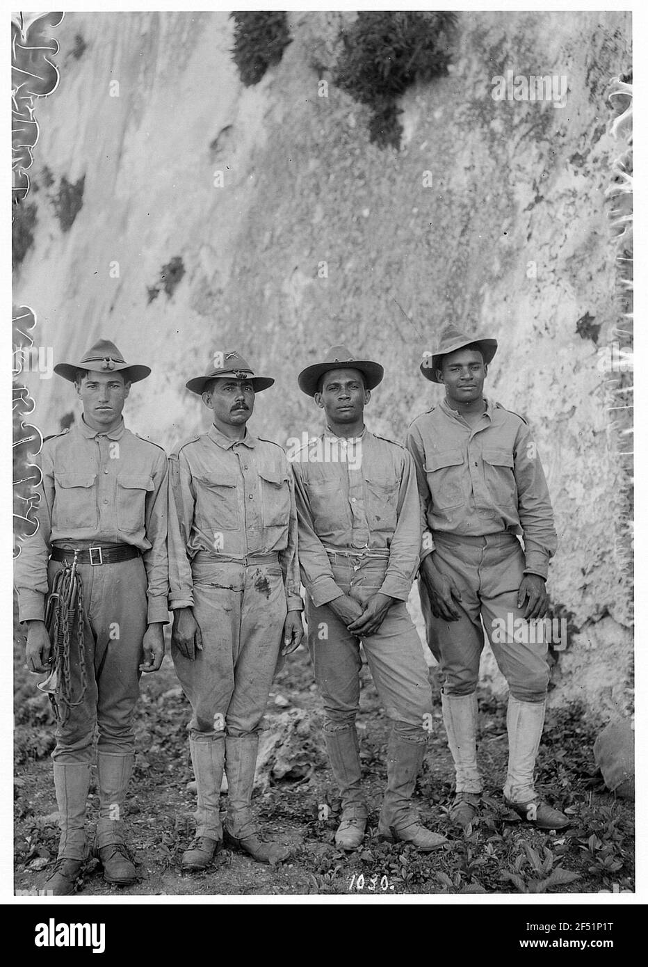 Havana (?), Cuba. Four soldiers in uniform posing in front of the ...
