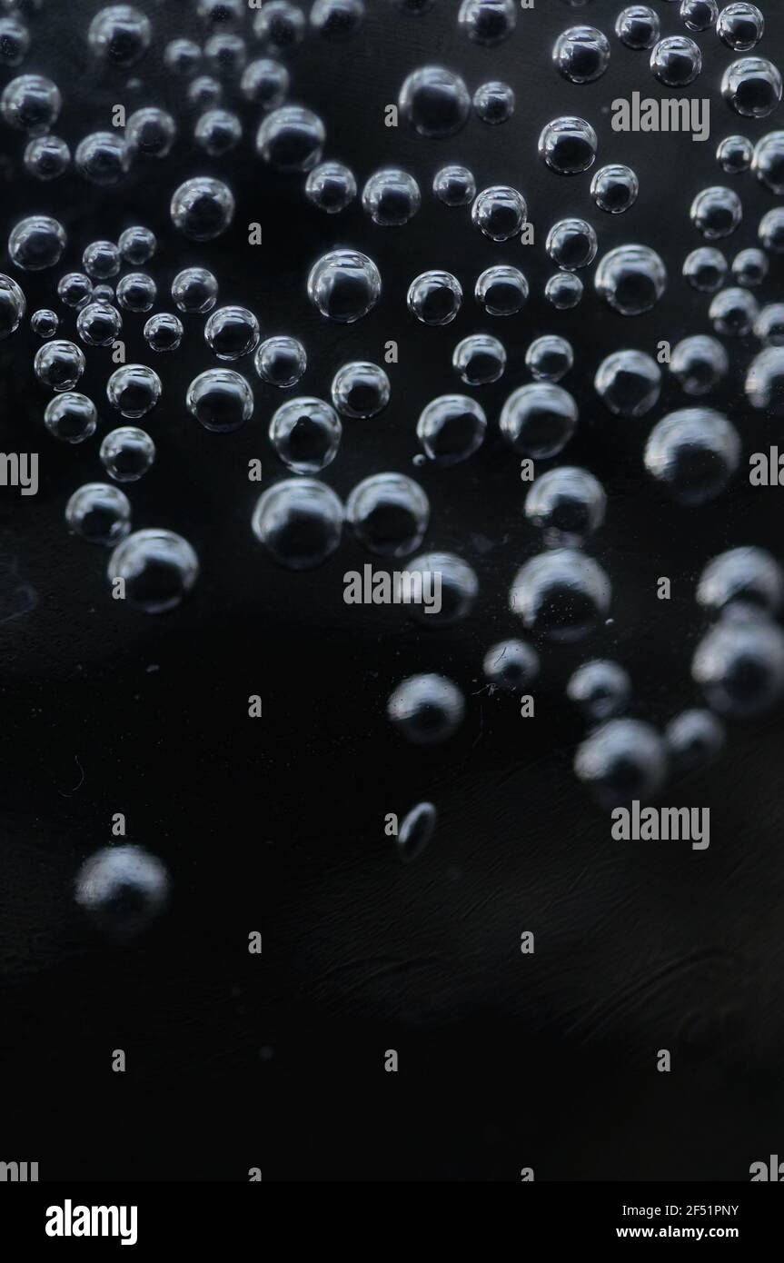 Close-up of gas bubbles in water. Soda water on close-up. Carbonated ...