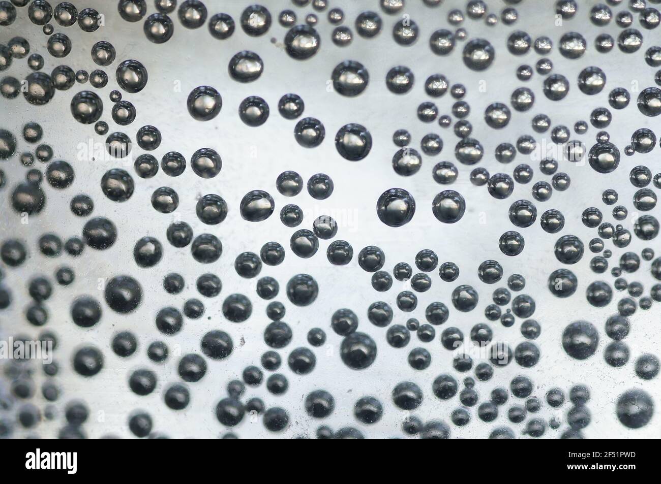 Close-up of gas bubbles in water. Soda water on close-up. Carbonated ...