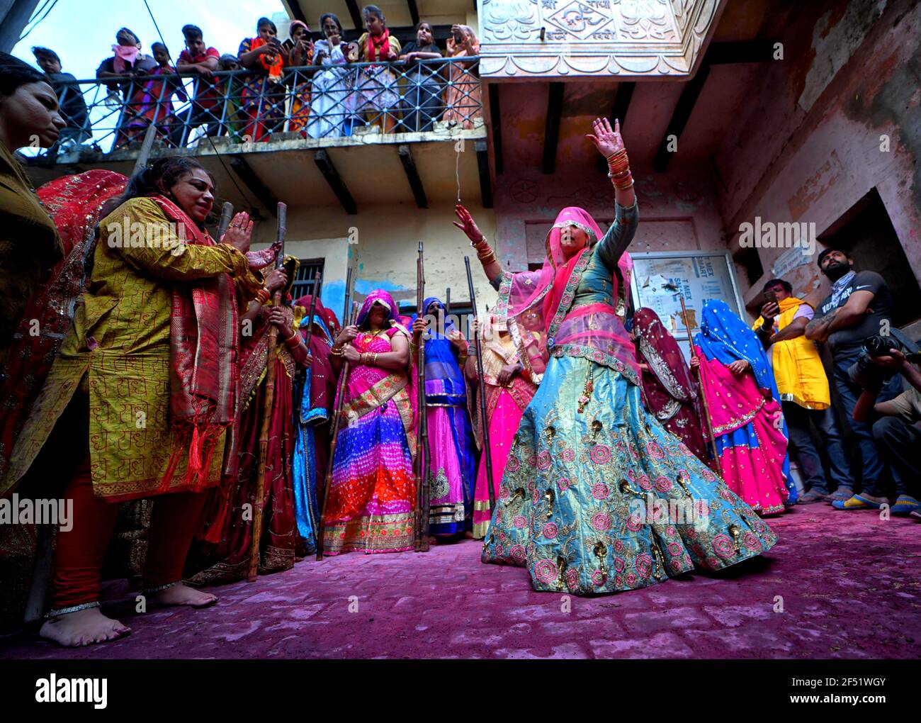 Mathura, India. 23rd Mar, 2021. A devotee dancing during the Lathmar ...