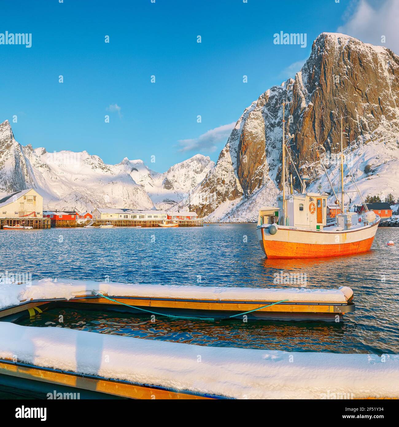 Fantastic winter view on Hamnoy village with port and Olstinden peak on ...