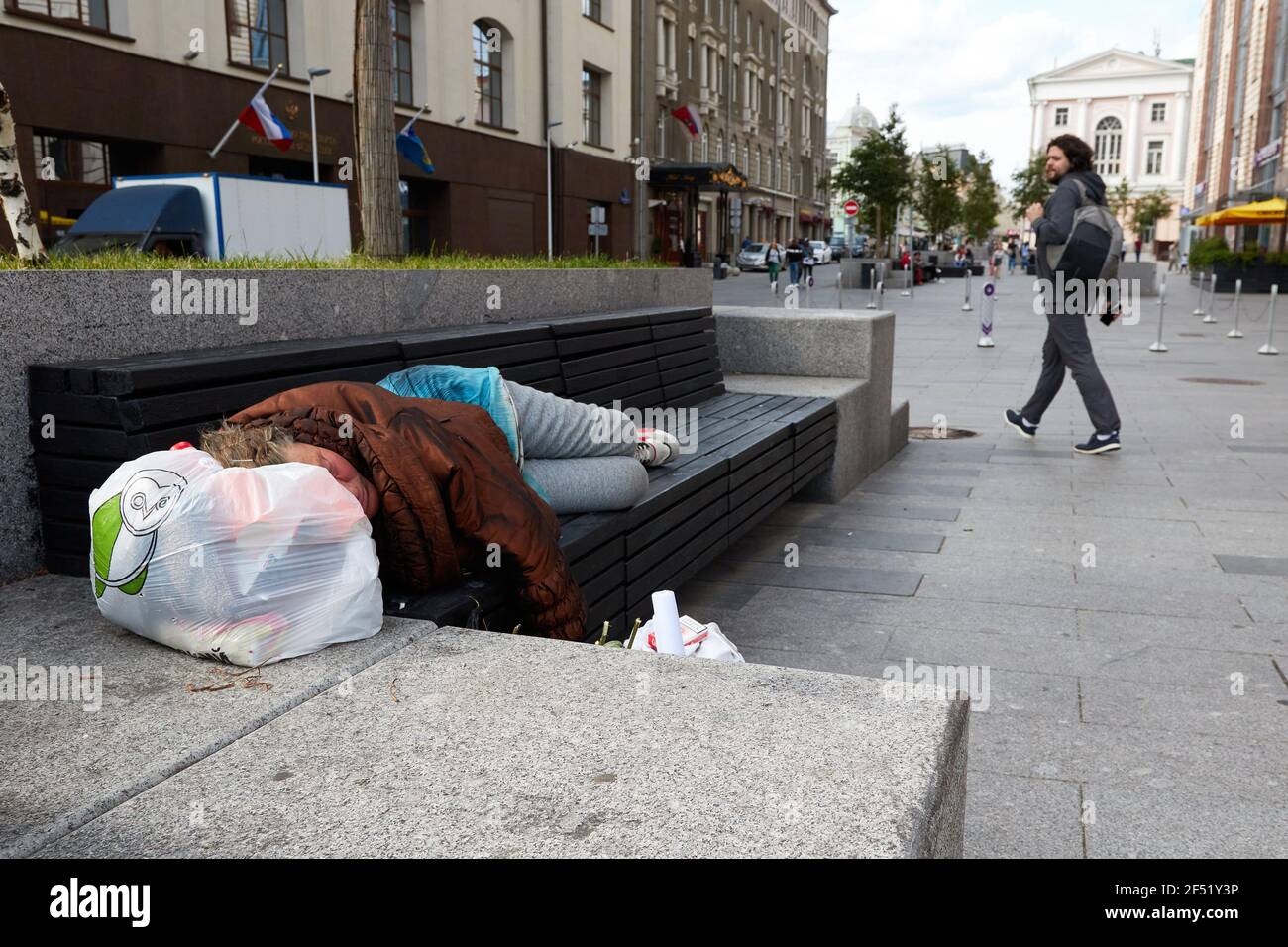 A homeless woman resting on the Lubyanka in the Central Administrative ...