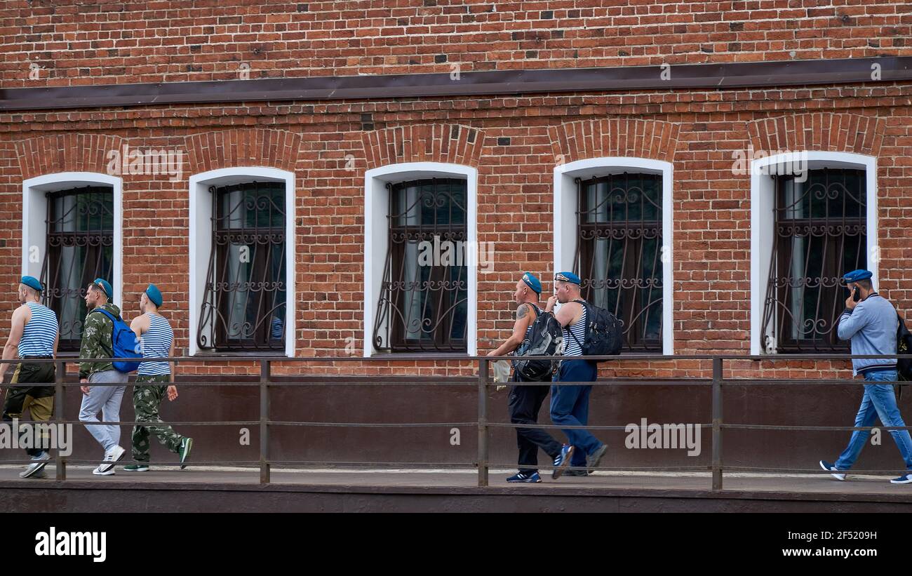 Former paratroopers on holiday walking along a red-brick Soviet ...