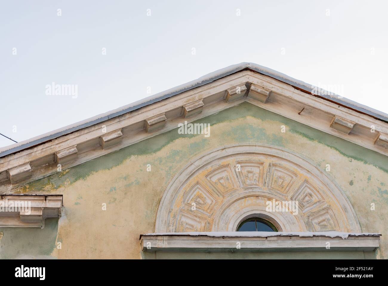 Dormer window with bas-relief. Old house in the center of Magnitogorsk ...