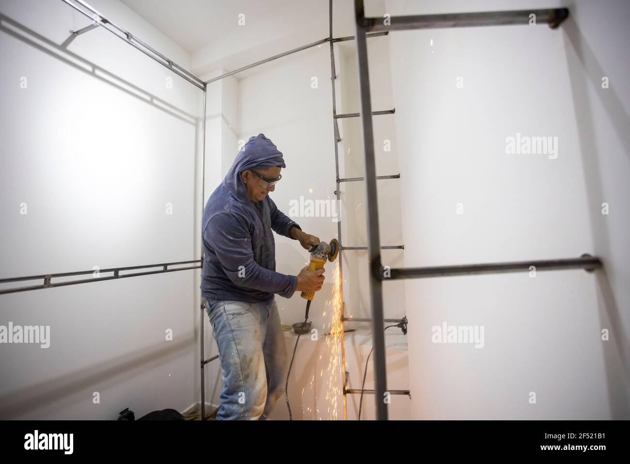 Colombian metal carpenter polishing metal in a dressing room Stock ...
