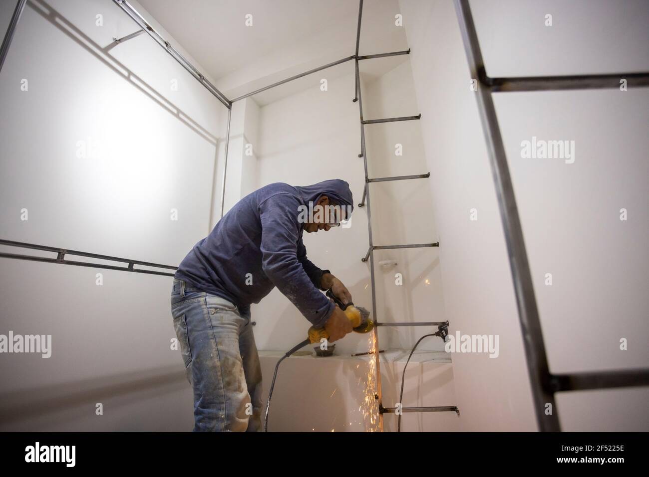 Colombian metal carpenter polishing metal in a dressing room Stock ...