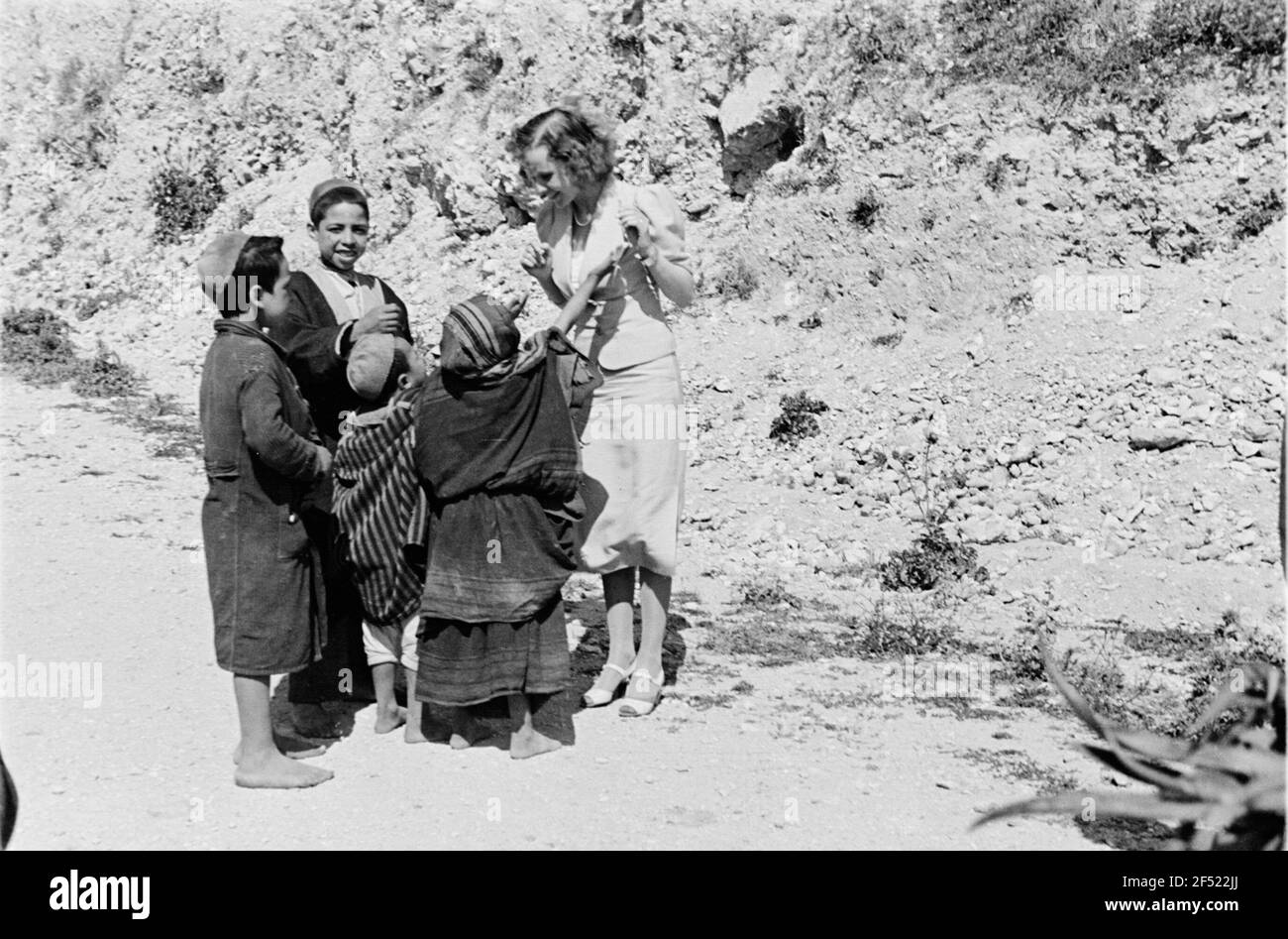 Travel Photos Orient. Tourist at the landing with native children Stock ...