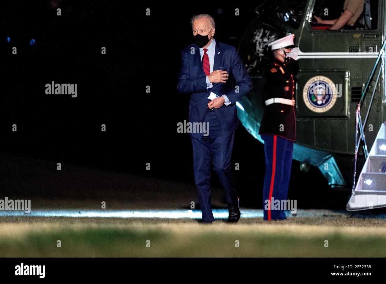 United States President Joe Biden walks on the South Lawn of the White ...
