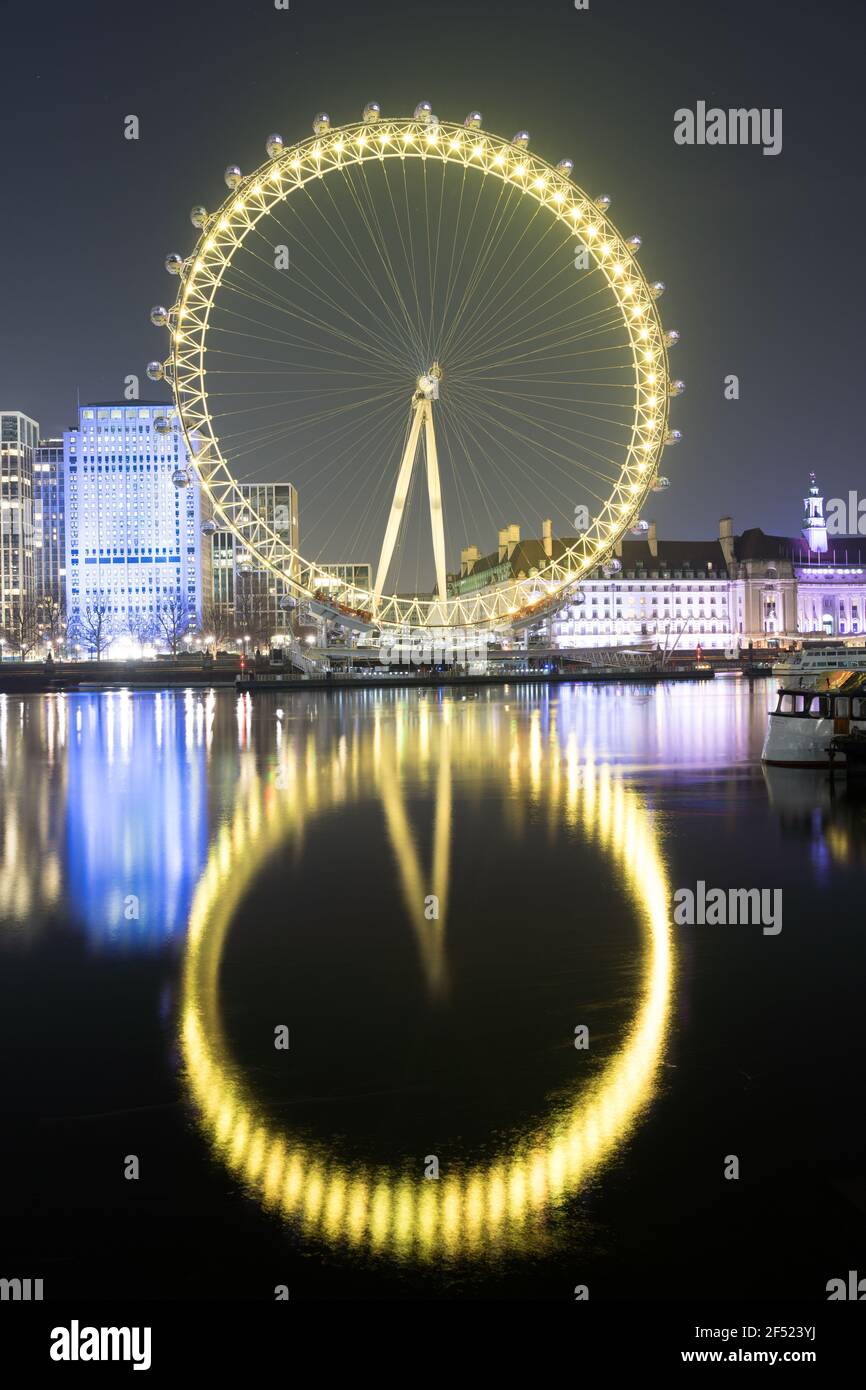 23rd March 2021, national reflection day when London eye yellow lights ...