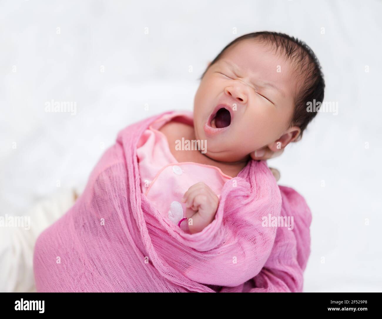 Yawning infant hi-res stock photography and images - Alamy