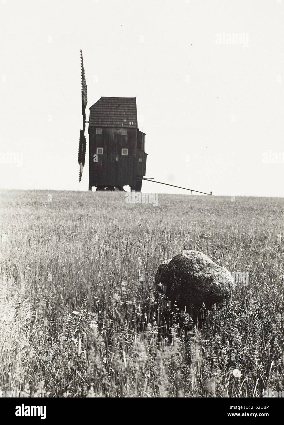 Stone cross and windmill Stock Photo - Alamy