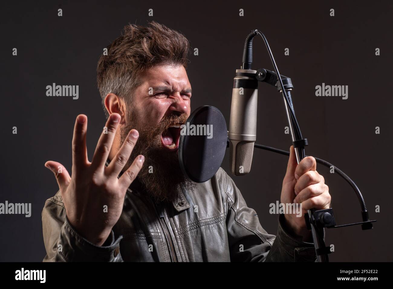 Handsome man in recording studio. Music performance vocal. Singer ...