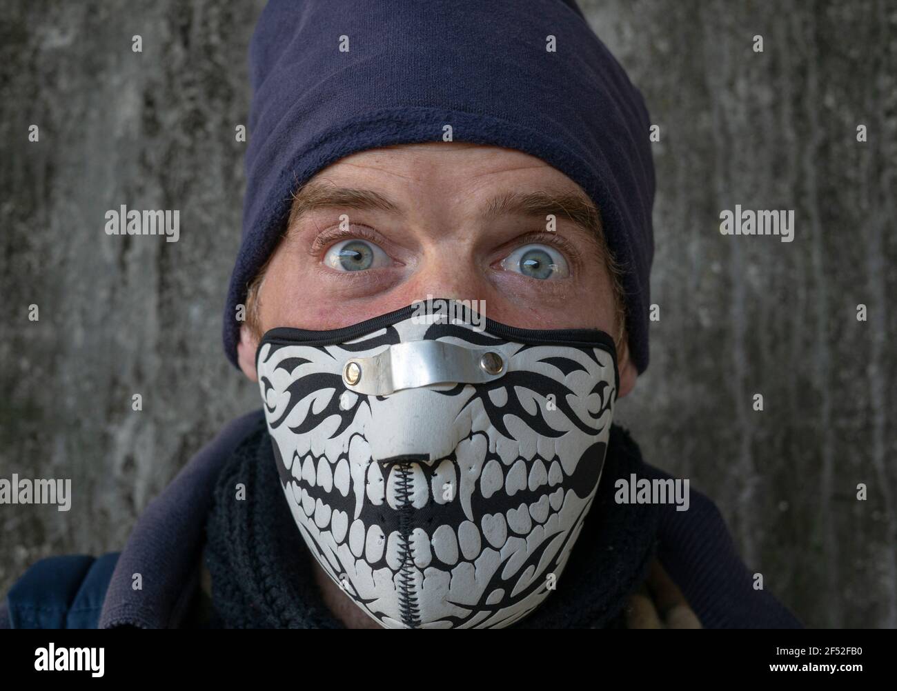 blue eyes boy wearing mask, playful look. surprised Stock Photo - Alamy