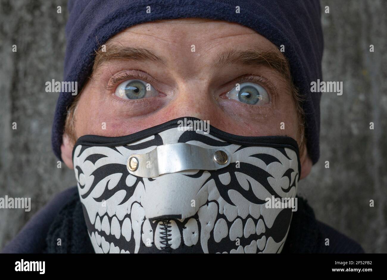 blue eyes boy wearing mask, playful look. surprised Stock Photo - Alamy
