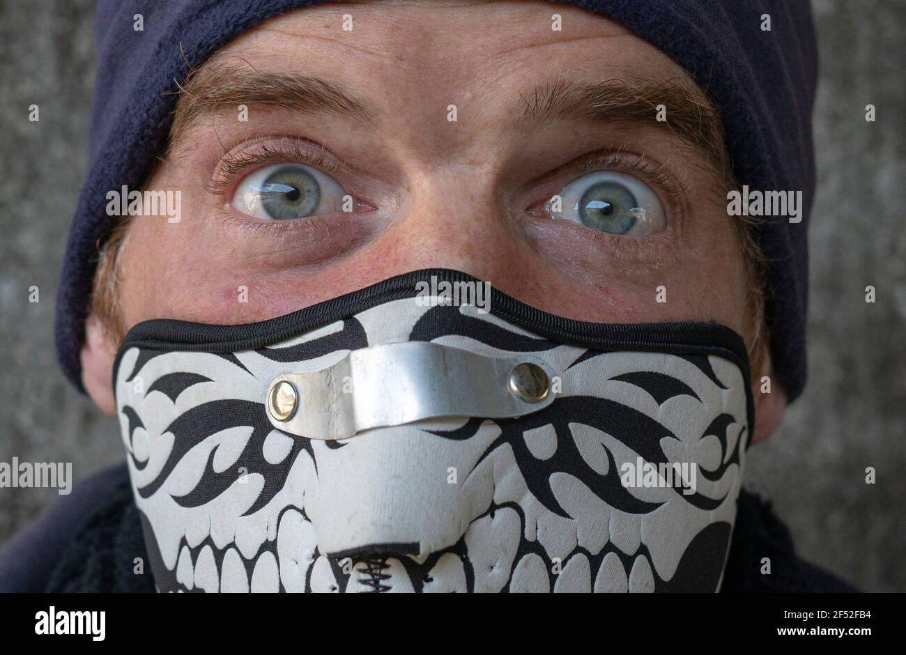blue eyes boy wearing mask, playful look. surprised Stock Photo - Alamy