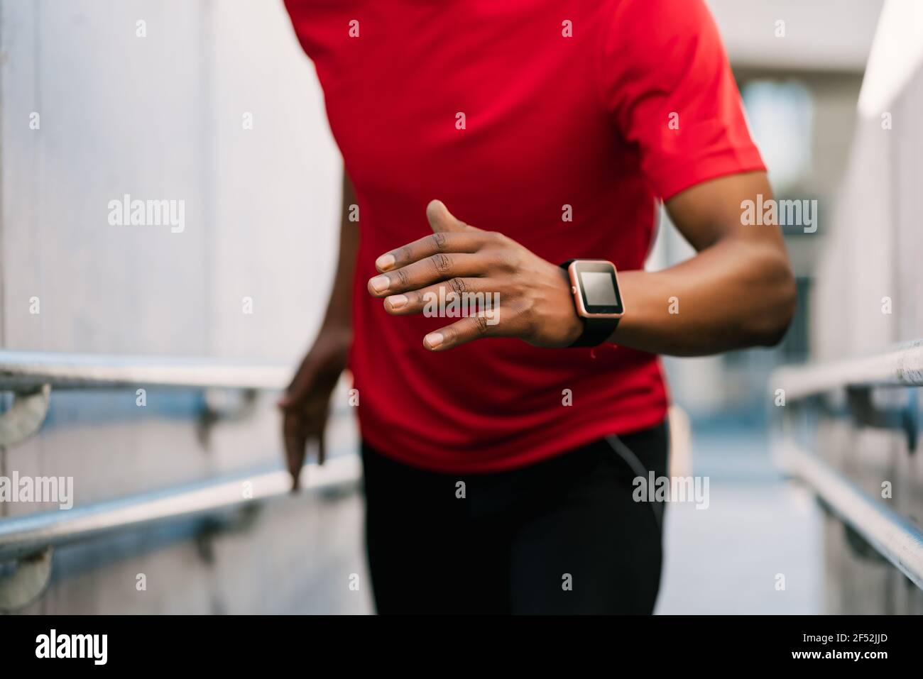 Athletic man running and doing exercise outdoors Stock Photo - Alamy