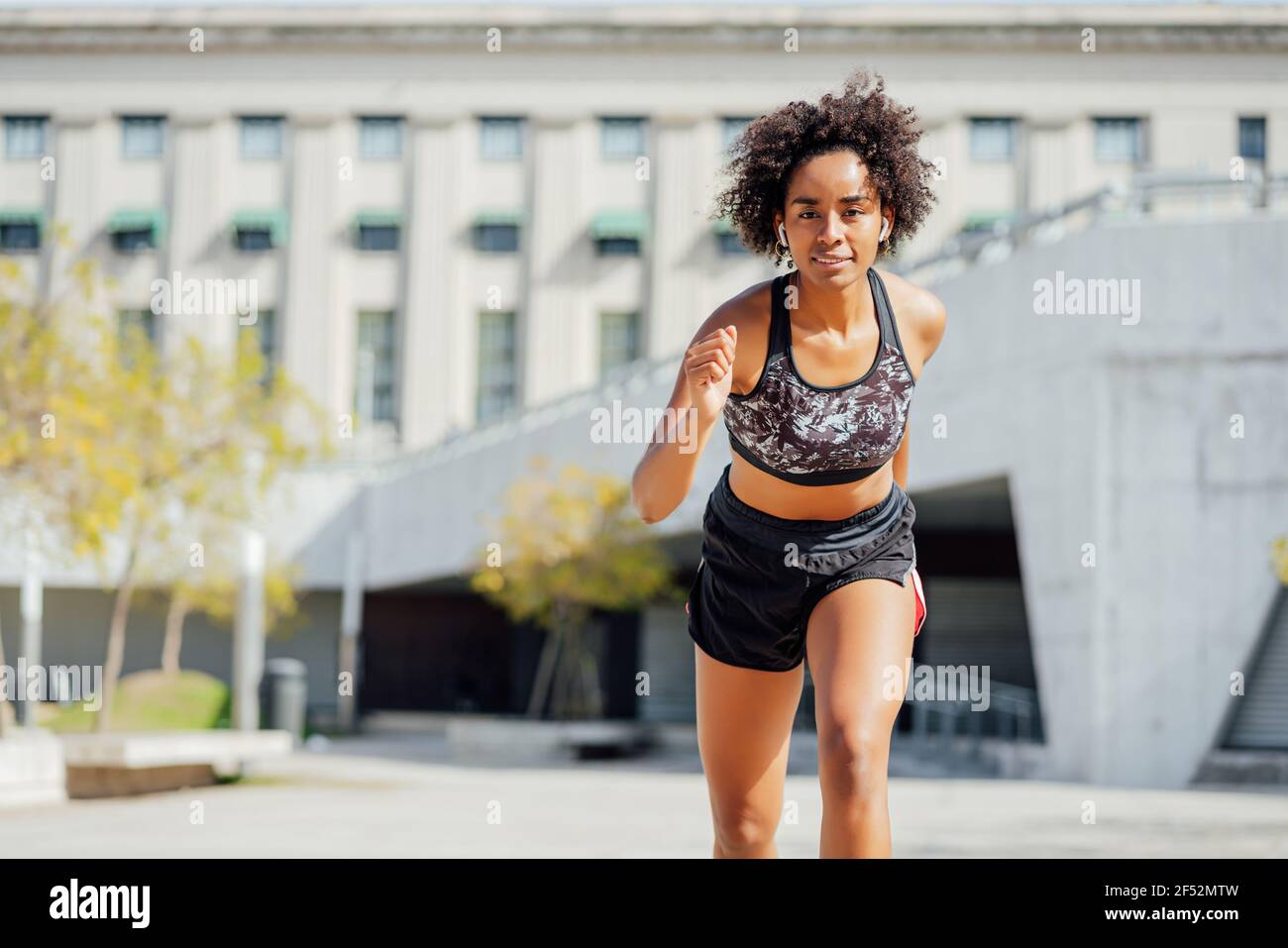 Female afro runner portrait hi-res stock photography and images - Alamy