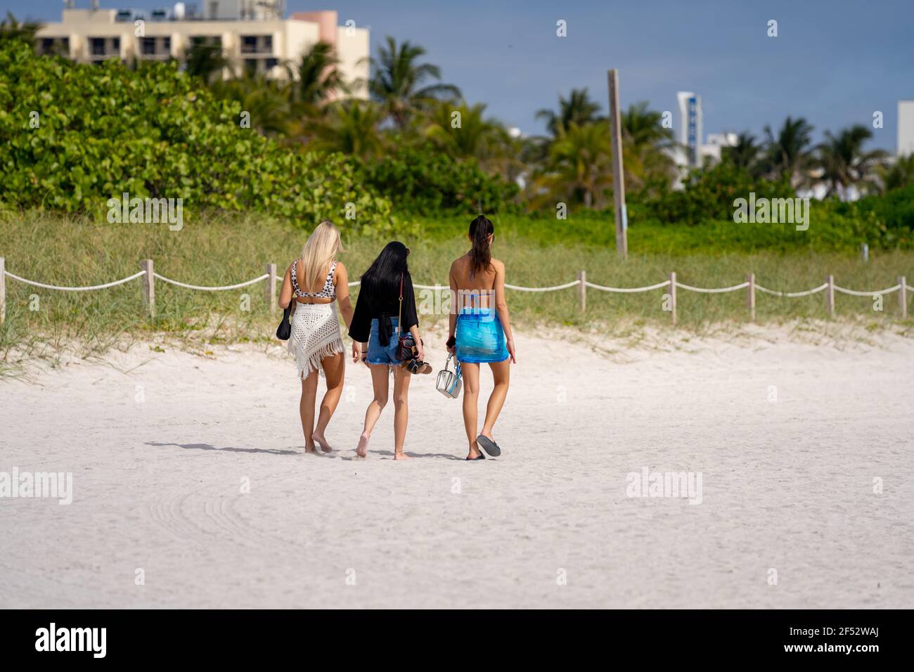 Women walking on the beach Miami spring break scene Stock Photo - Alamy