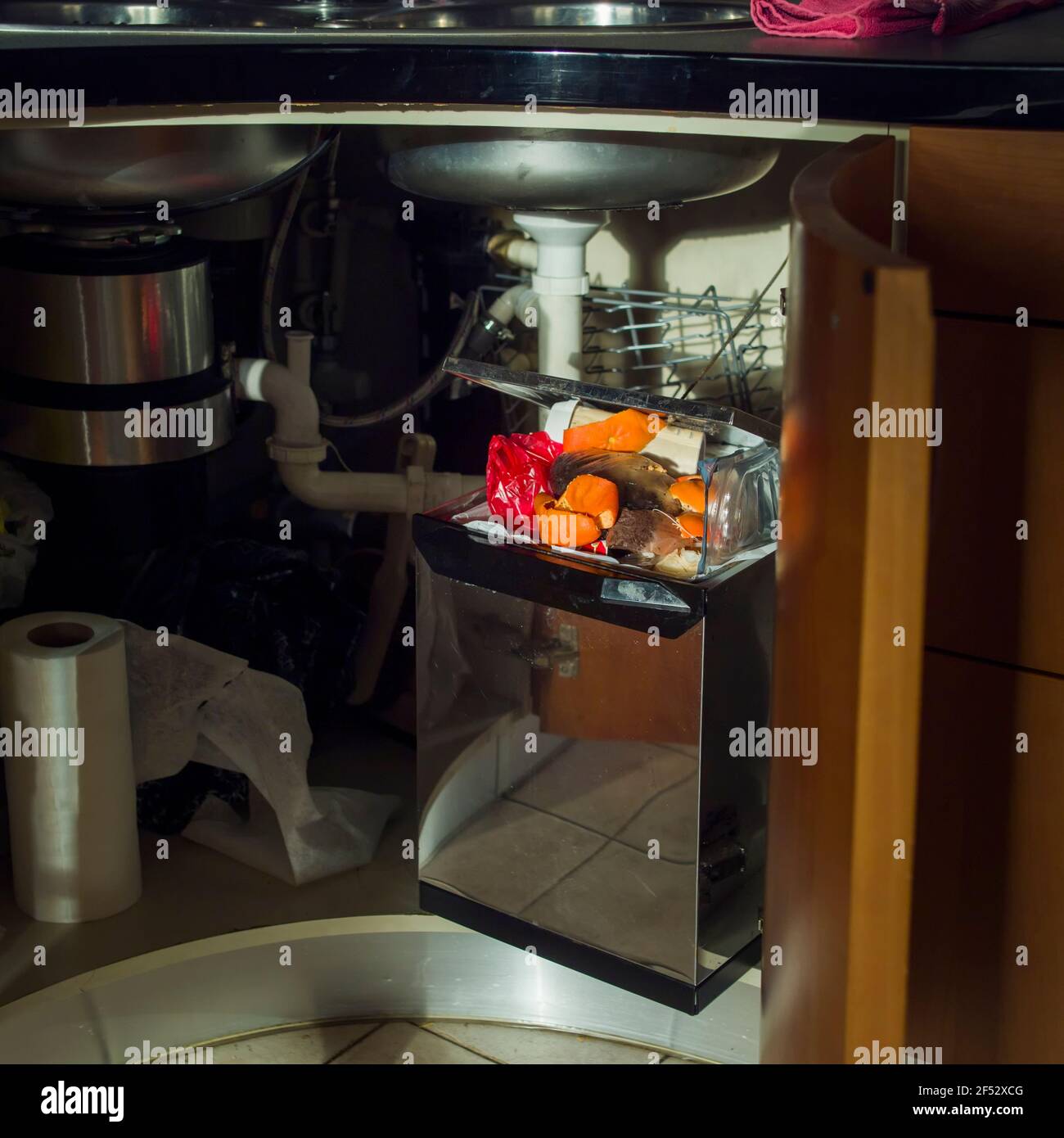A kitchen with a full rubbish bin, indoor daylight shot Stock Photo - Alamy