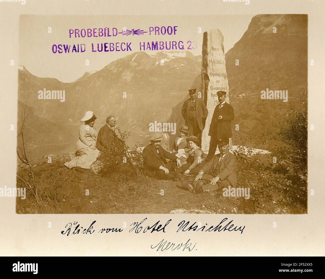 Merok / Norway: View from the Hotel Utiches. Tourists sit at a memorial ...