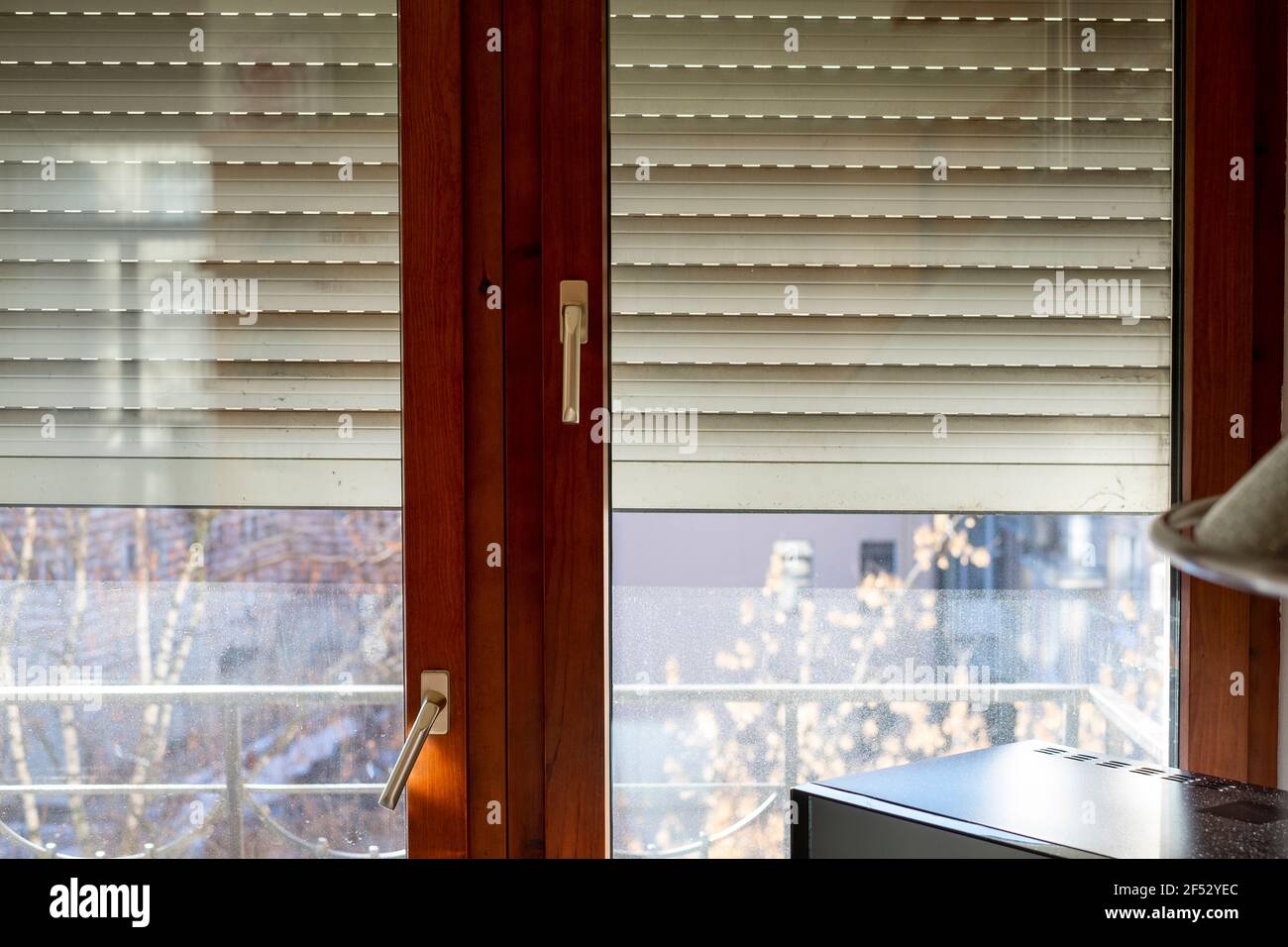 A half shut window with steel blinds, indoor cropped shot Stock Photo ...
