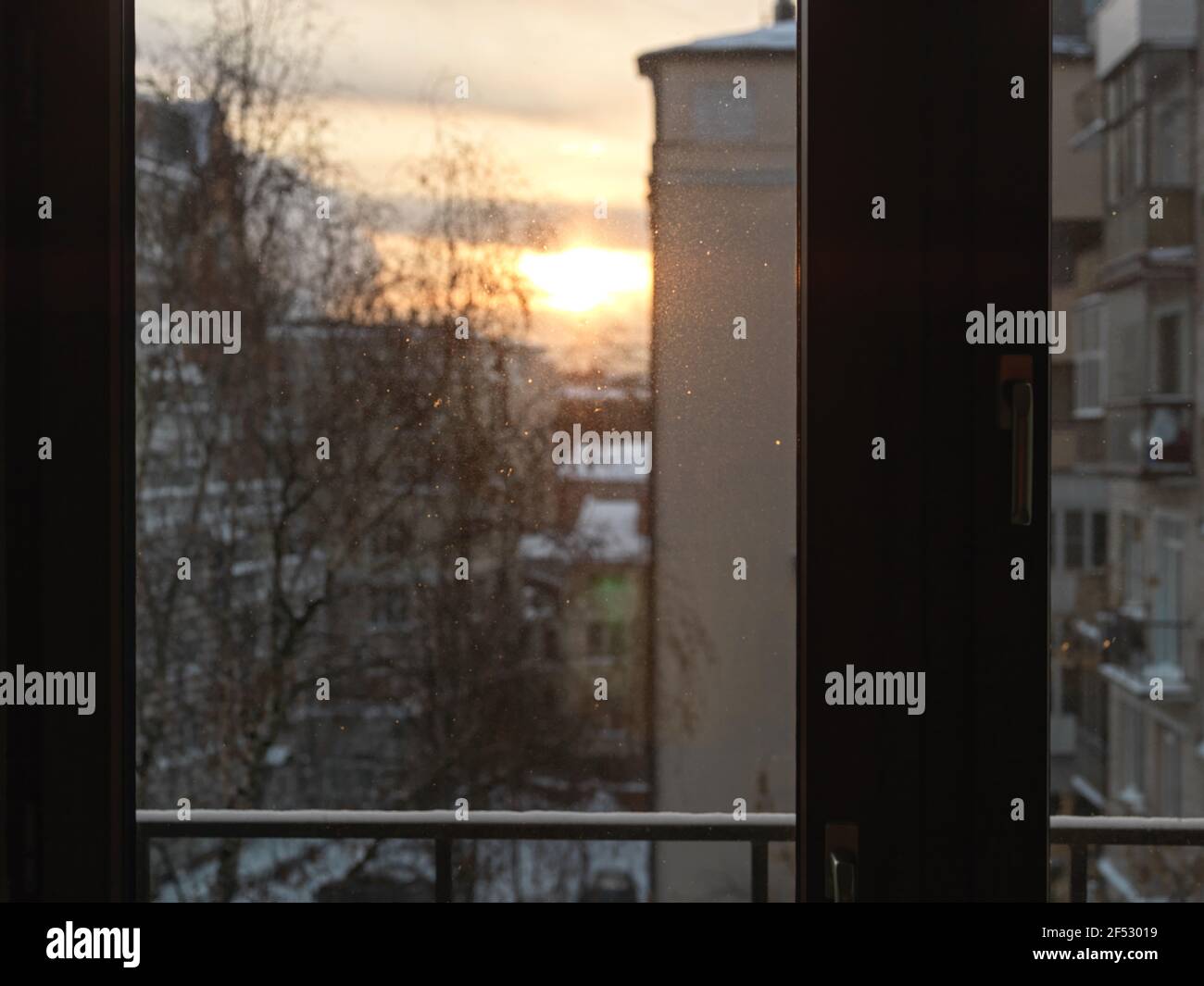 Sunrise in the city through a dusty window, winter scene Stock Photo ...