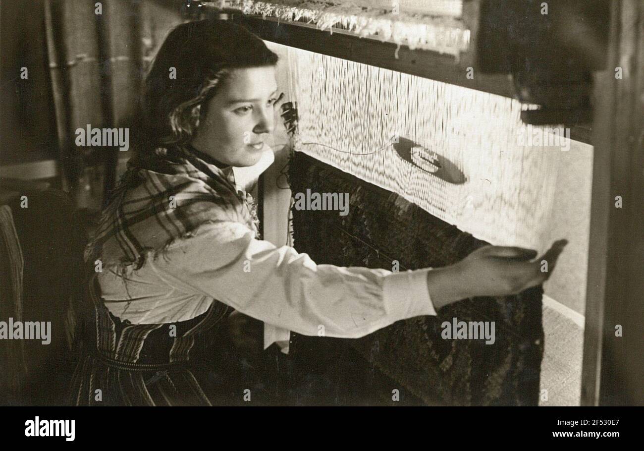 Finland. Girl on the loom, weaving the Ryijy carpet Stock Photo - Alamy