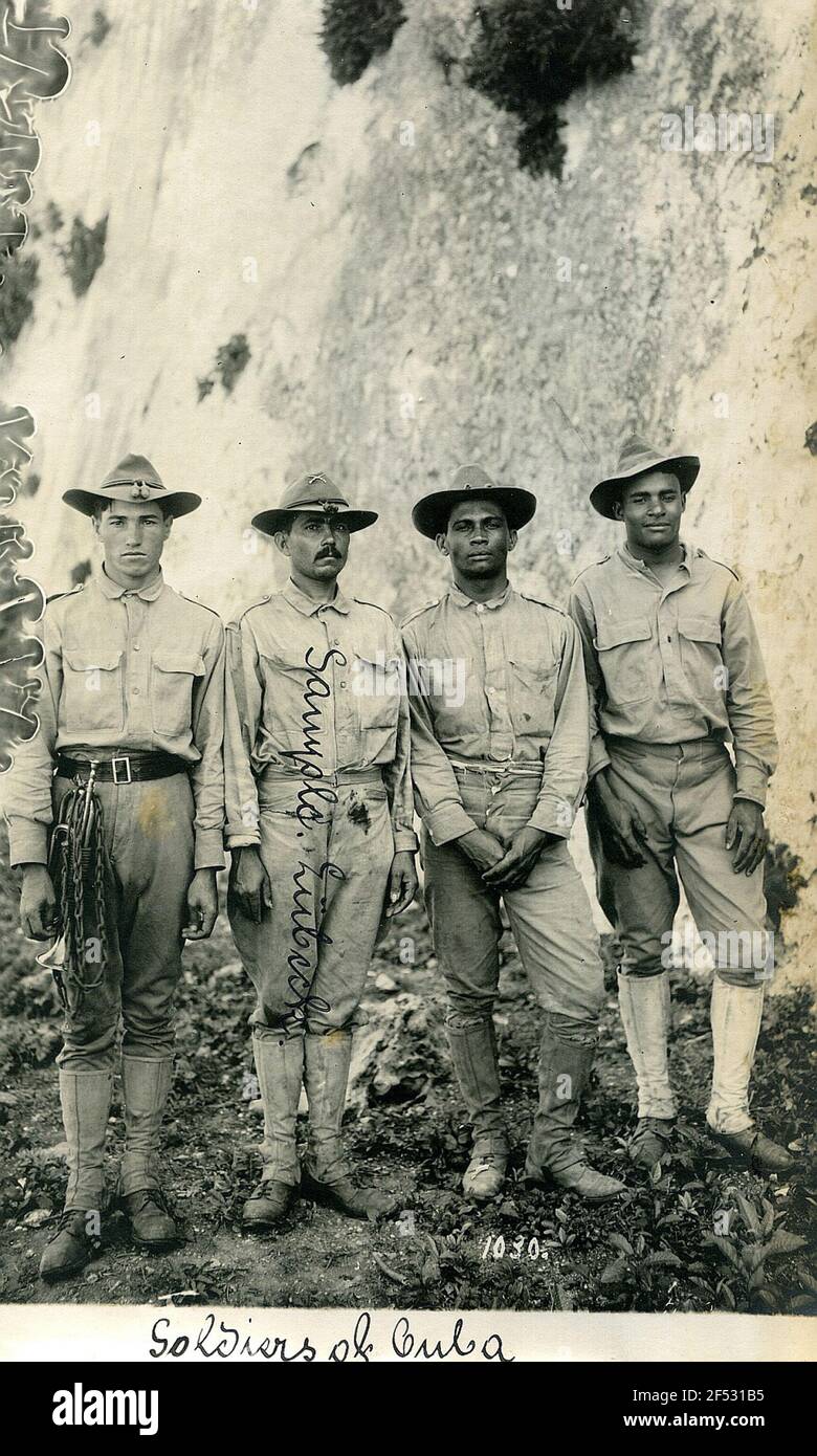 Havana (?), Cuba. Four soldiers in uniform posing in front of the ...