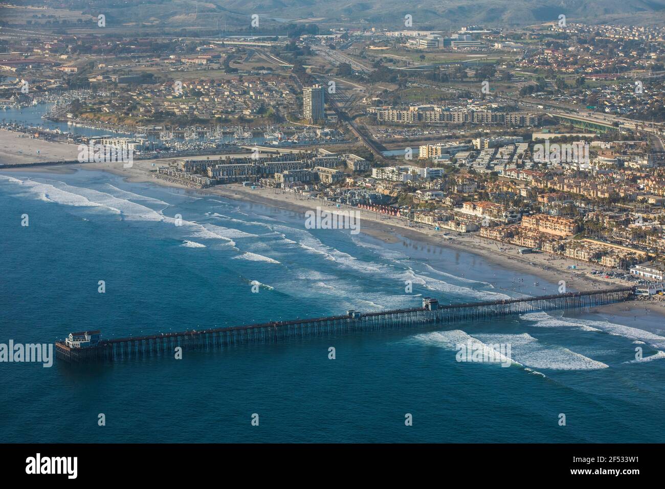 Daytime aerial view of the beach and downtown city area of Oceanside ...