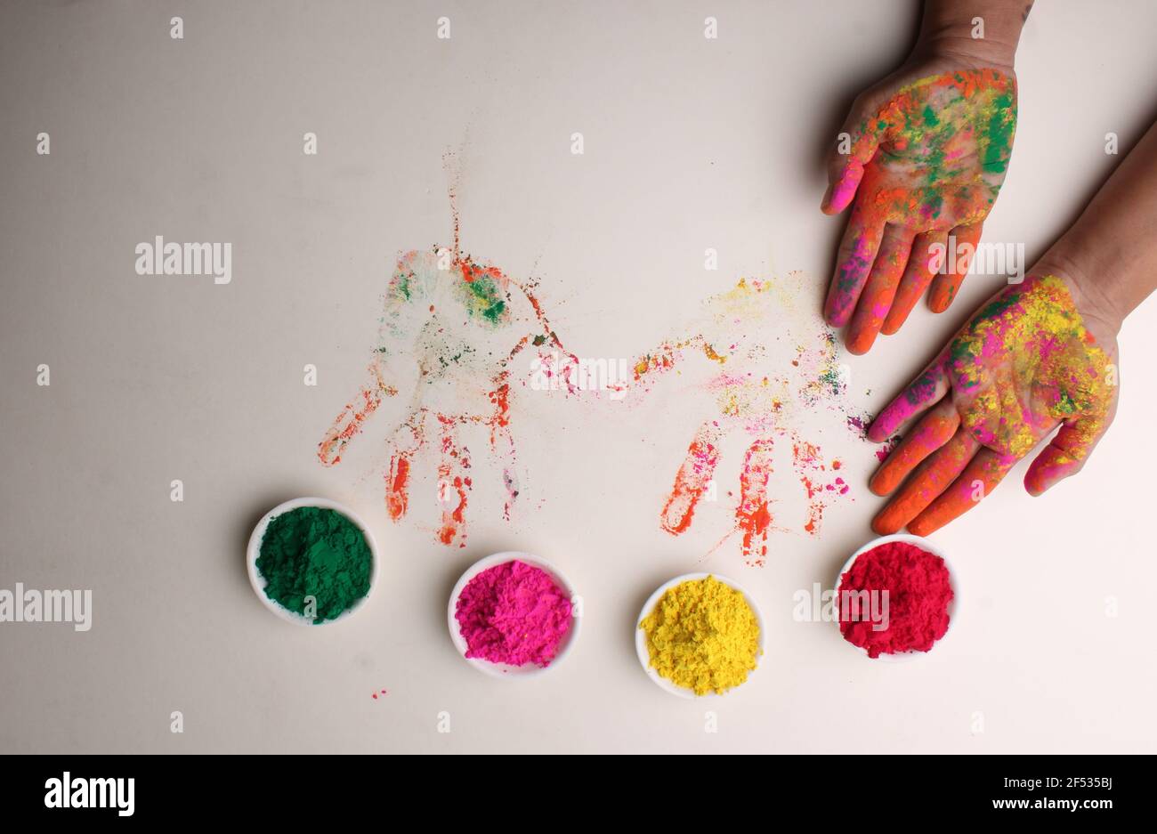 holi greetings view of hands with gulal for Hindu spring festival of ...