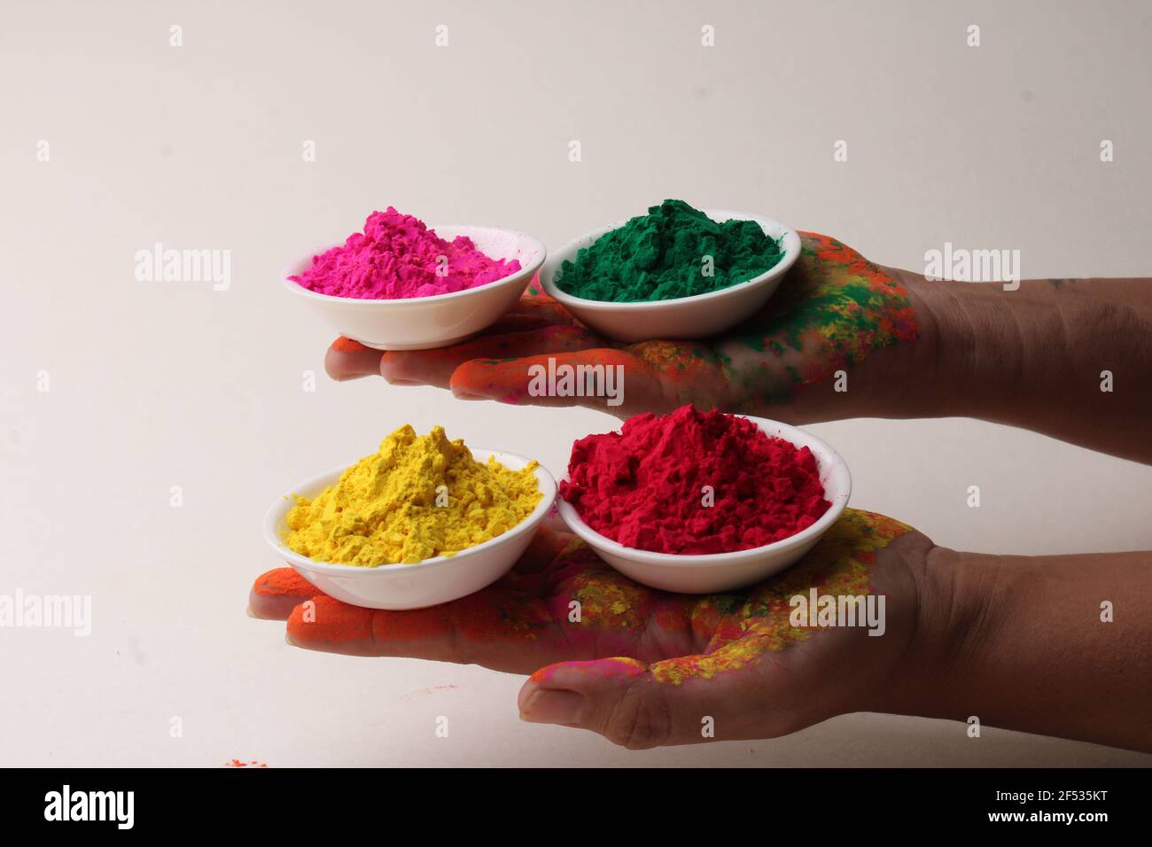 holi greetings view of hands with gulal for Hindu spring festival of ...