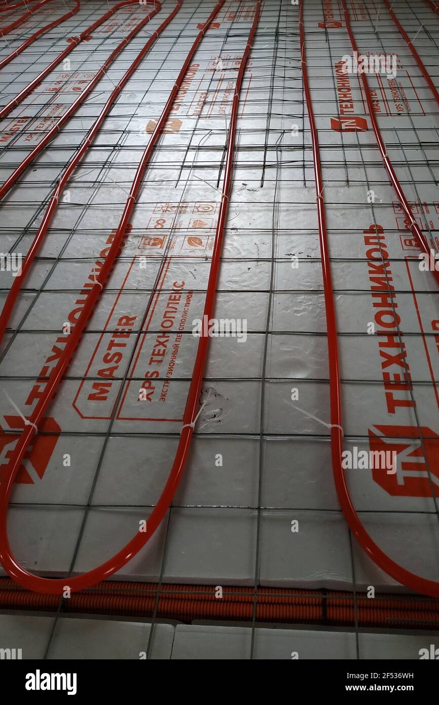 Installation of underfloor heating system, closeup on the water floor ...