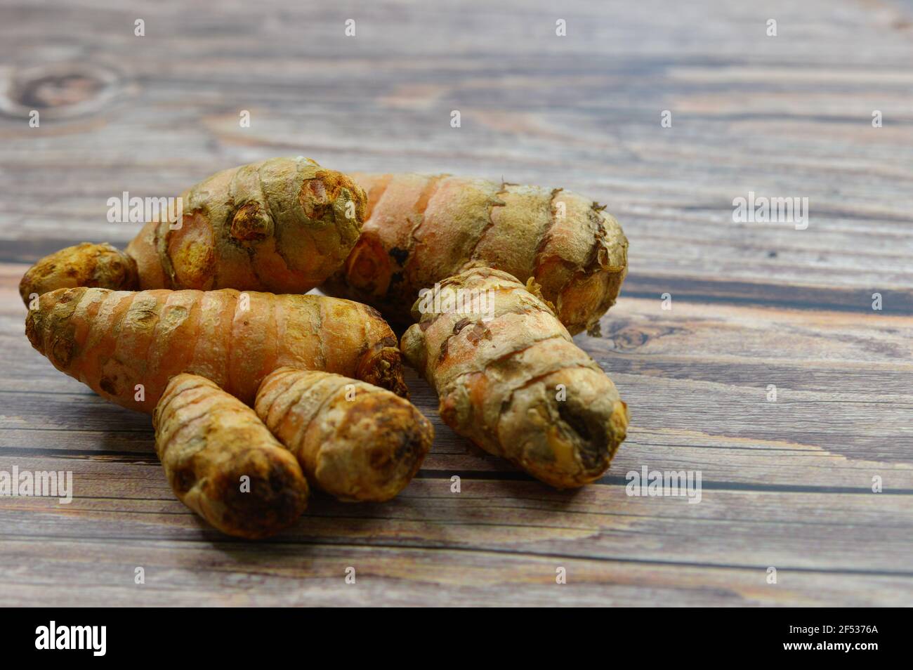 Close-up of slices and whole Turmeric root or rhizome. Native to the ...