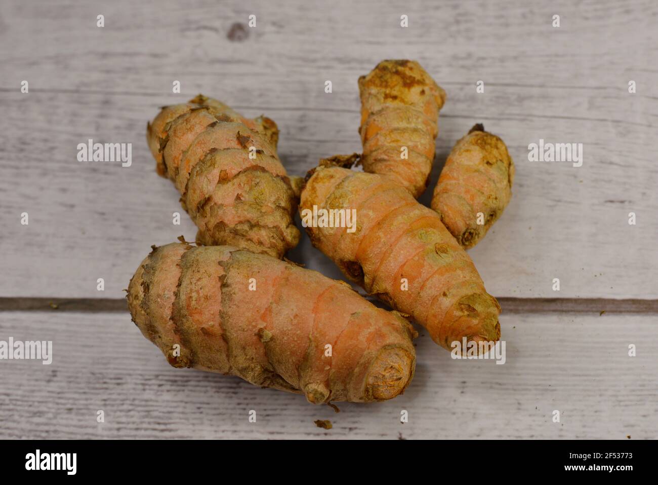 Close-up of slices and whole Turmeric root or rhizome. Native to the ...