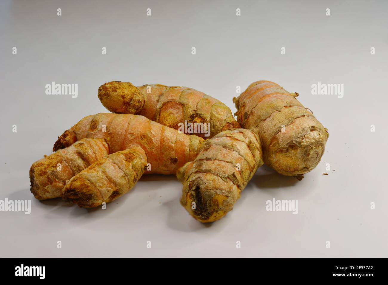 Close-up of slices and whole Turmeric root or rhizome. Native to the ...