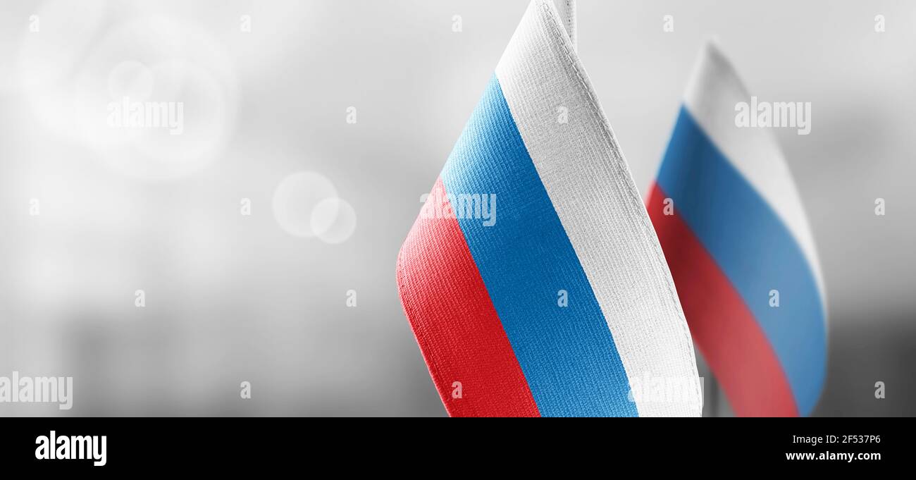 Small national flags of the Russia on a light blurry background Stock ...