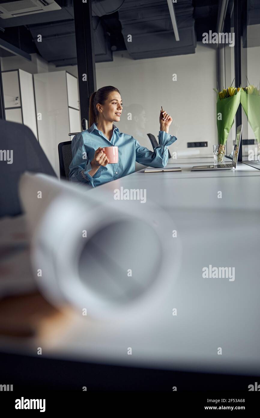 Beautiful office worker daydreaming in the workplace Stock Photo - Alamy