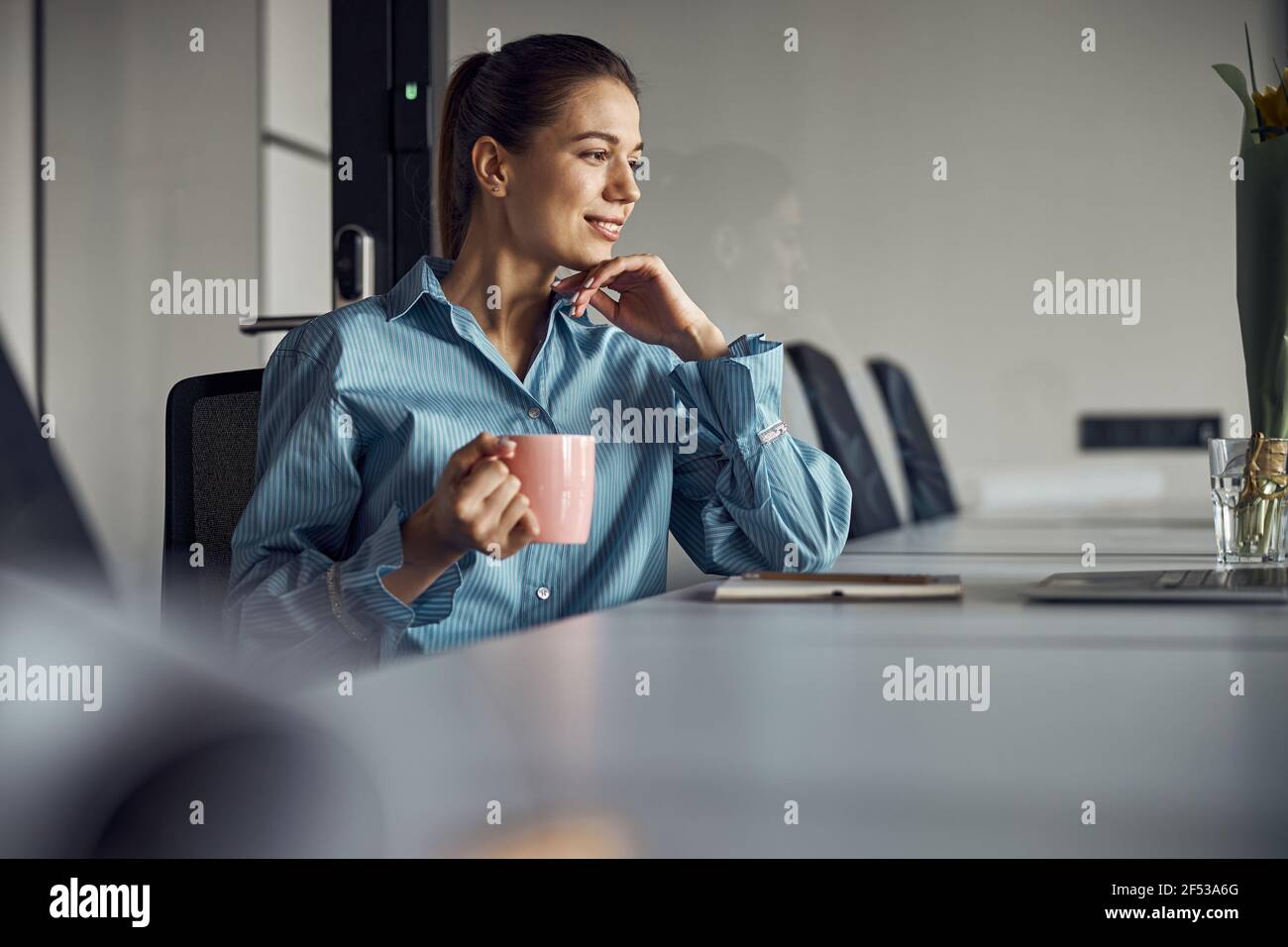Female office worker surfing the net during the coffee break Stock ...